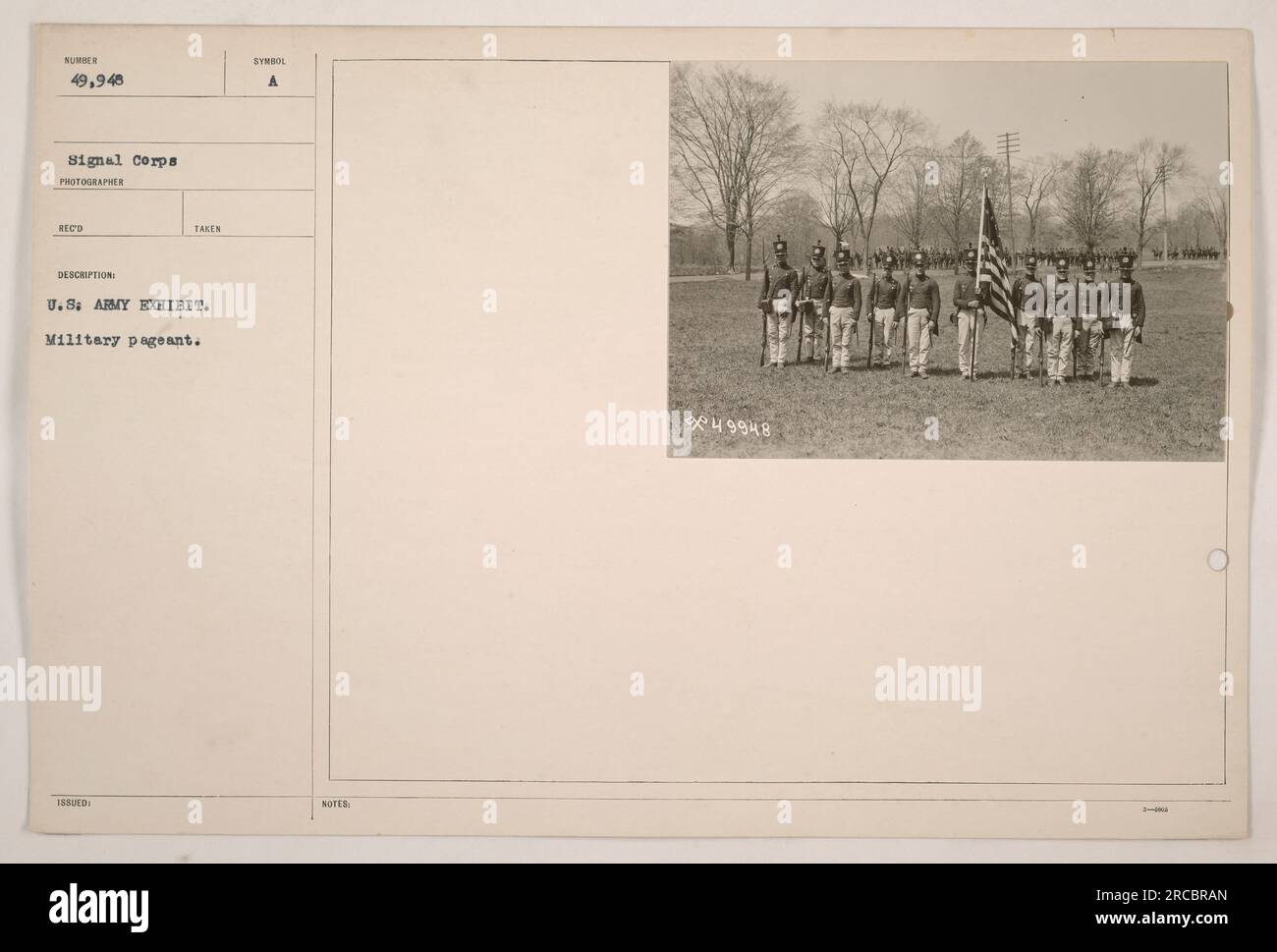 The image shows a U.S. Army exhibit during a military pageant. The ...
