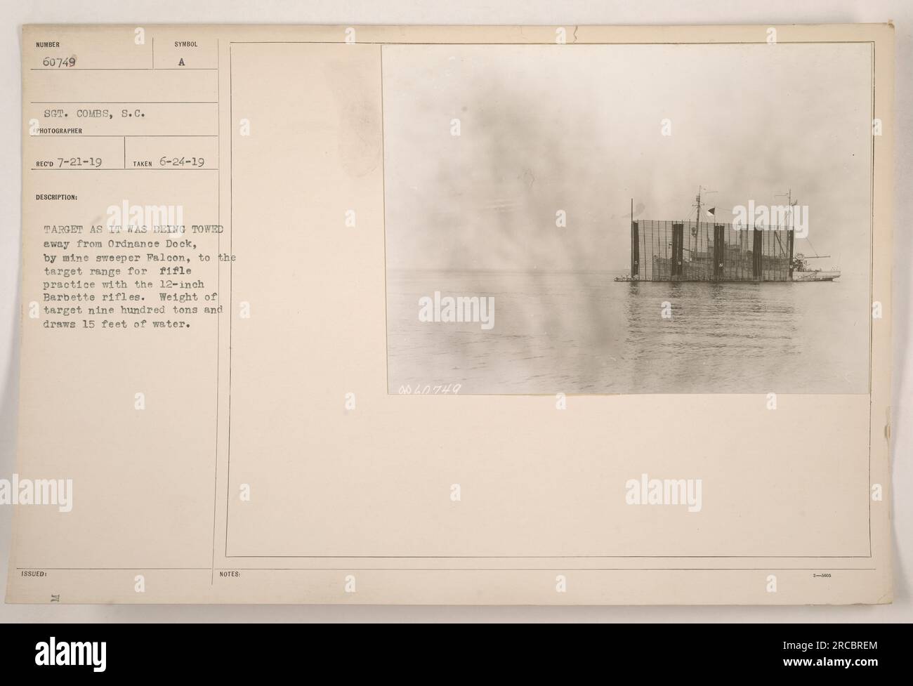 A target being towed away from Ordnance Dock by the mine sweeper Falcon ...