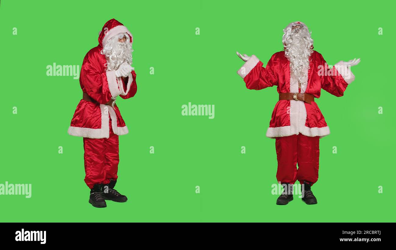 Santa claus praying to god with hands in a prayer, posing over full ...