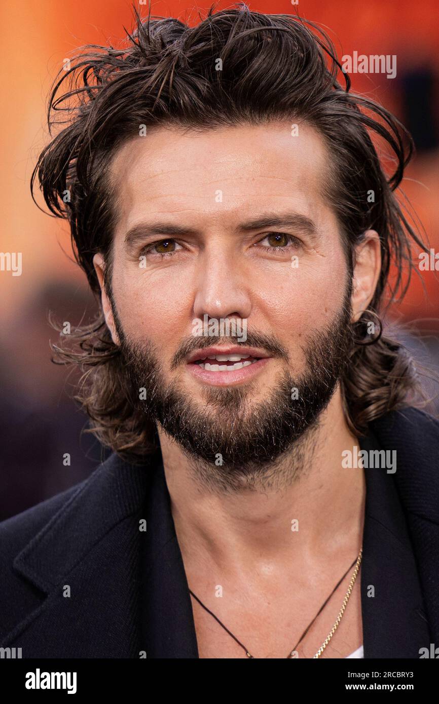 Guy Burnet poses for photographers upon arrival at the premiere for the ...
