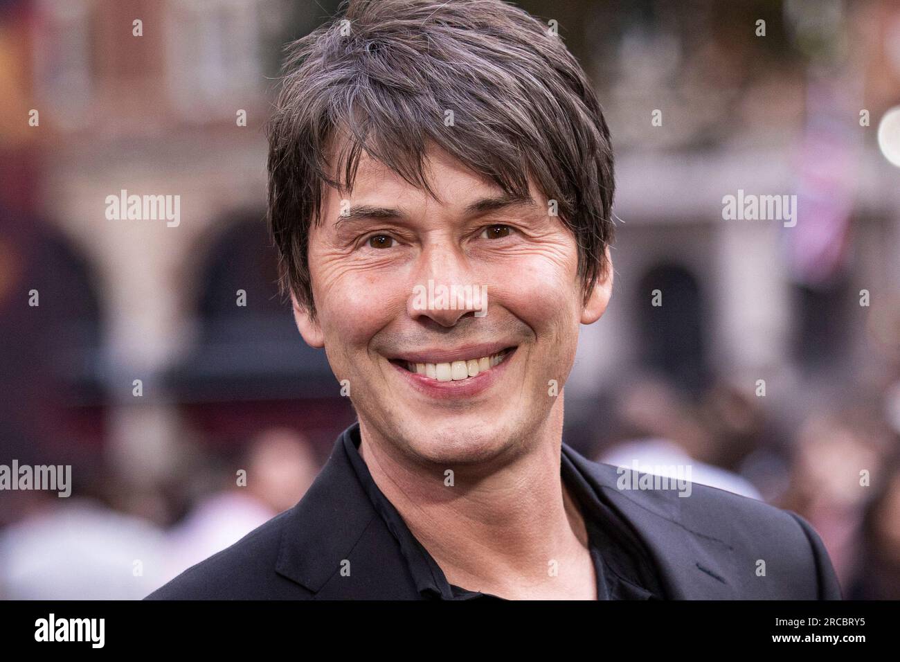 Professor Brian Cox poses for photographers upon arrival at the ...