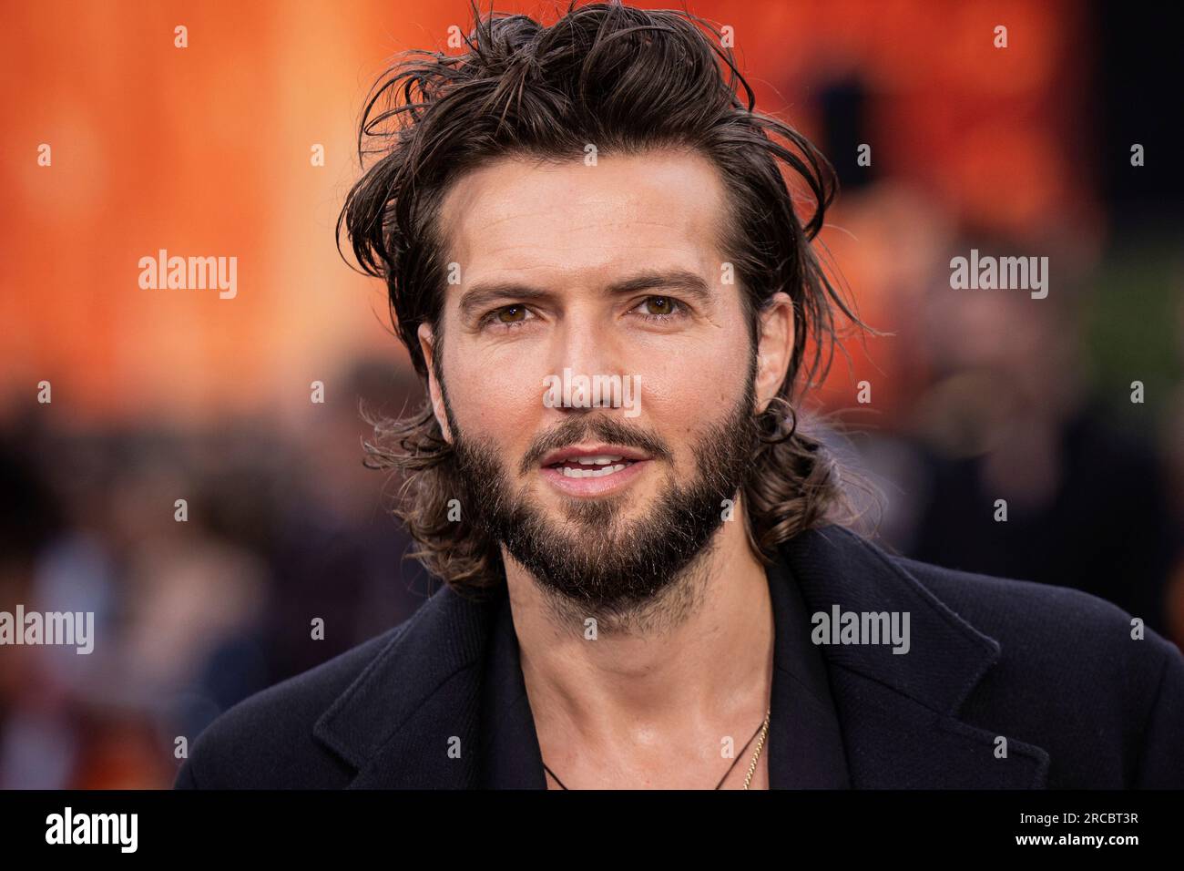 Guy Burnet poses for photographers upon arrival at the premiere for the ...