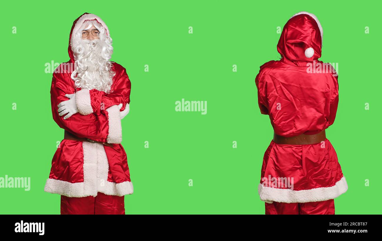 Adult in santa claus festive suit wearing fake white beard, posing over ...