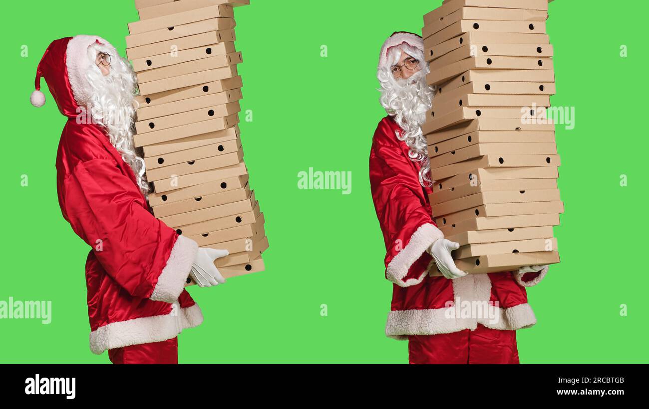 Santa claus posing with pile of pizza boxes, carrying huge stack of ...