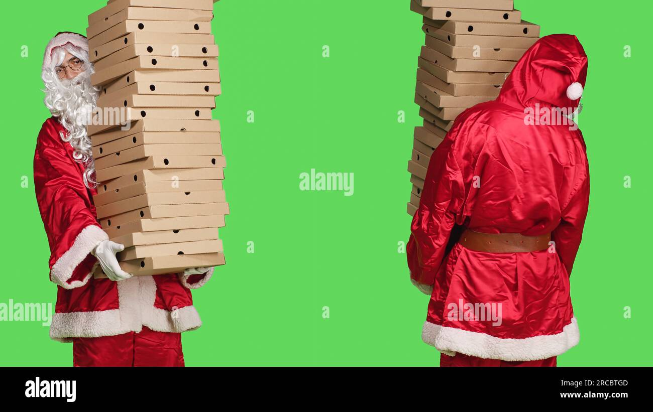 Xmas character with stack of pizza boxes, carrying big pile of delivery ...