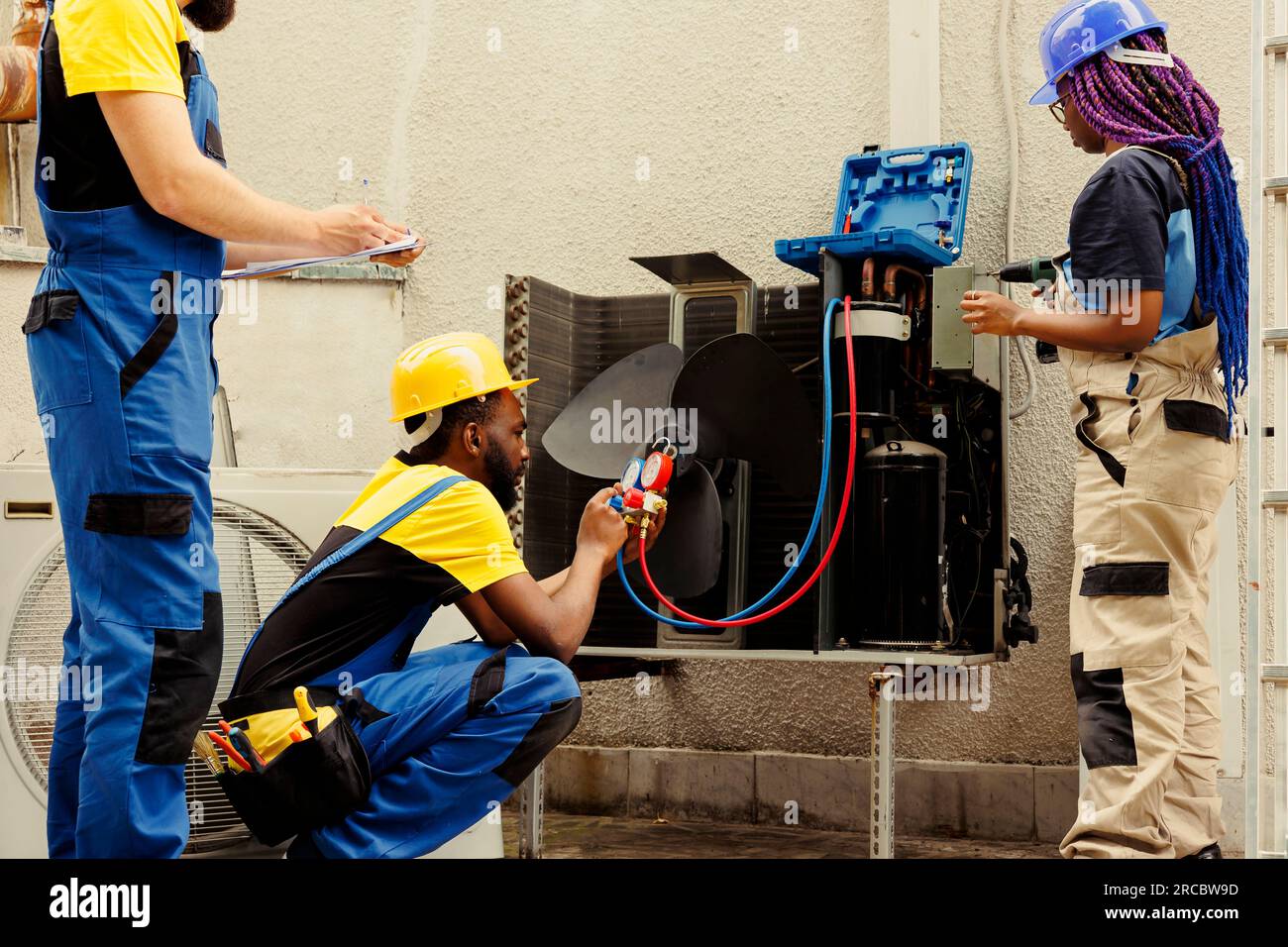 Adept repairman expertly refilling freon in HVAC system while using ...