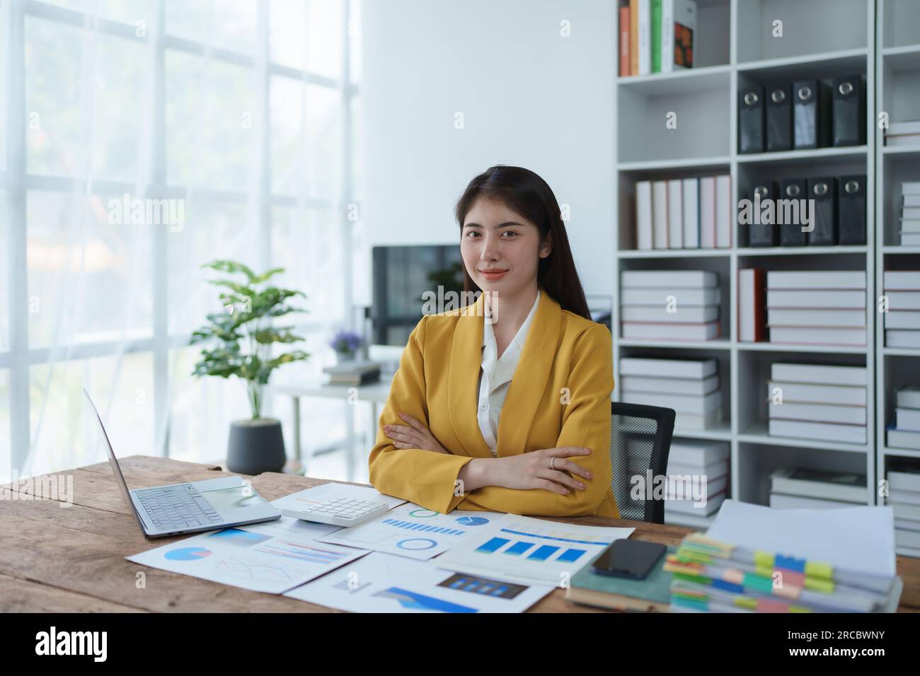 Portrait of a woman business owner showing a happy smiling face as he ...