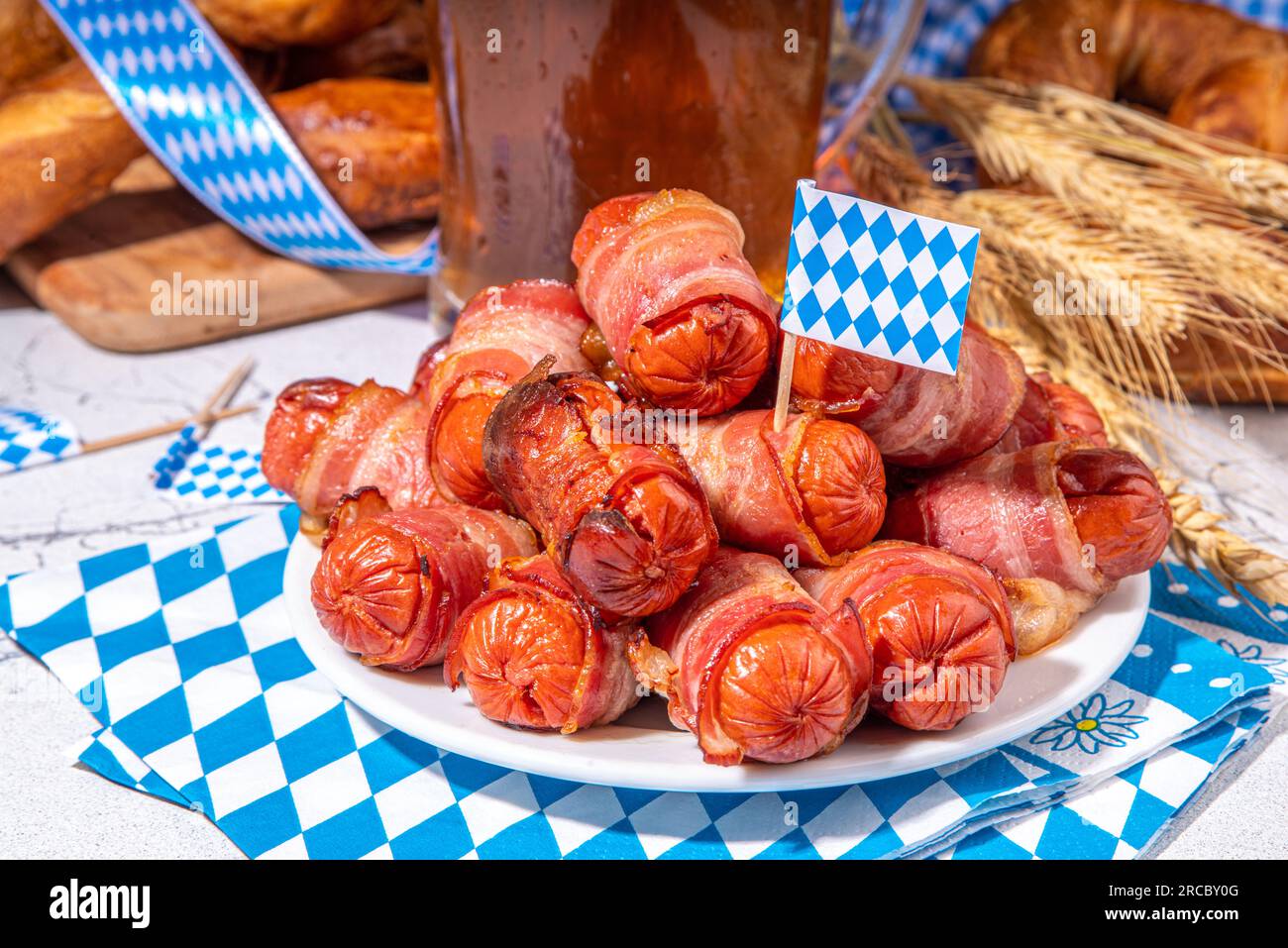 Oktoberfest party food. Pretzel hot dogs, puff pastry rolls with ...