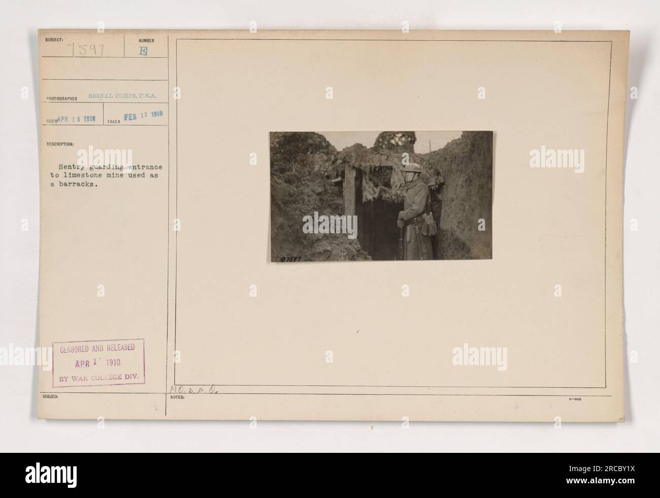 Sentry guarding entrance to limestone mine used as a barracks. The ...