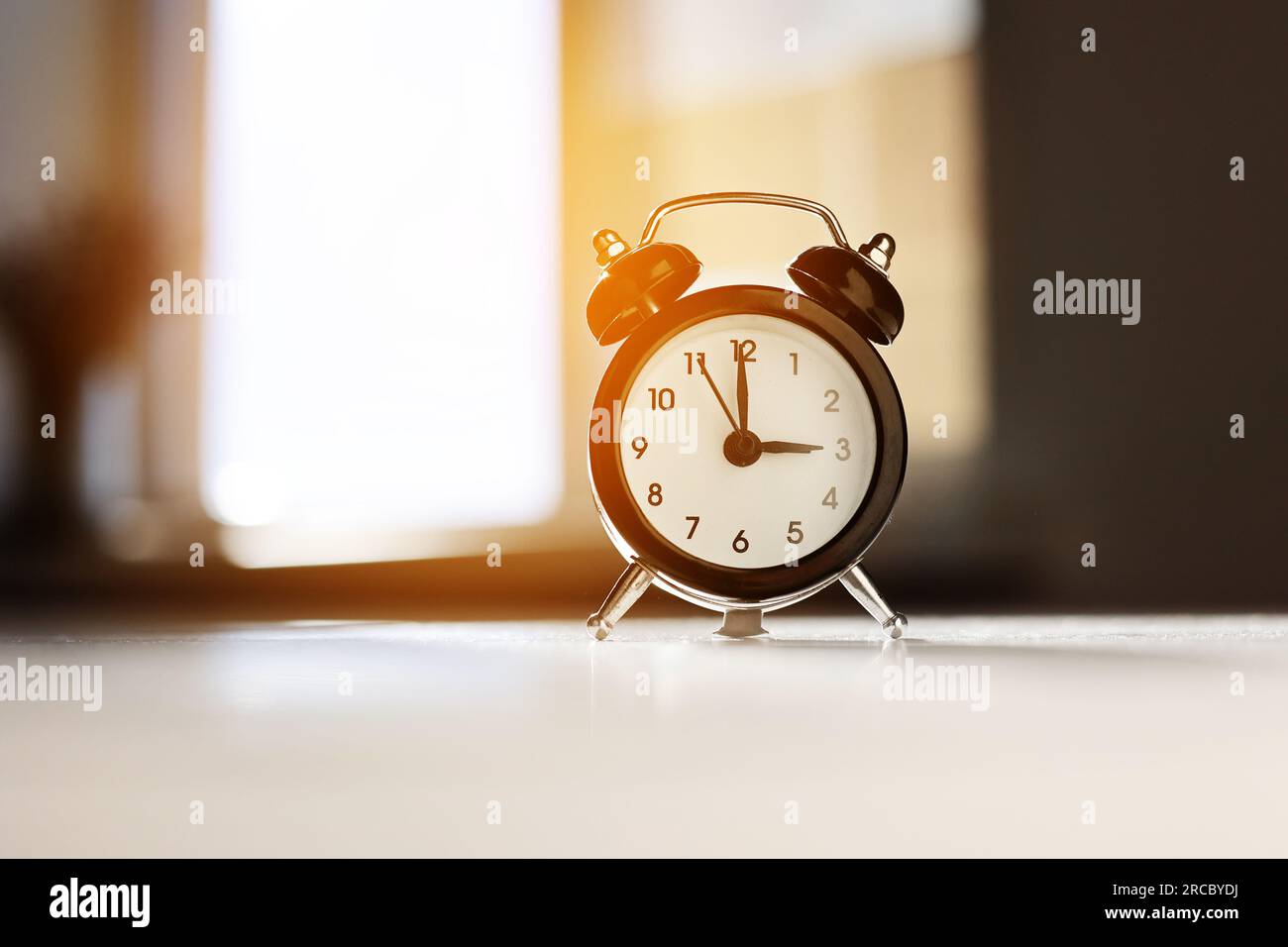 Modern black and white alarm clock in retro style isolated on white and ...
