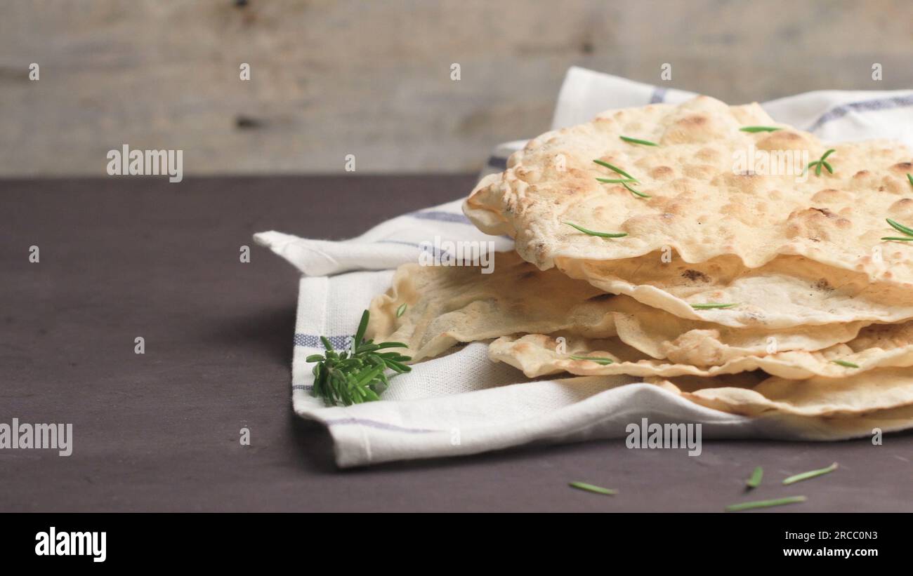 Homemade hot chapati on kitchen countertop background. Slide from left ...