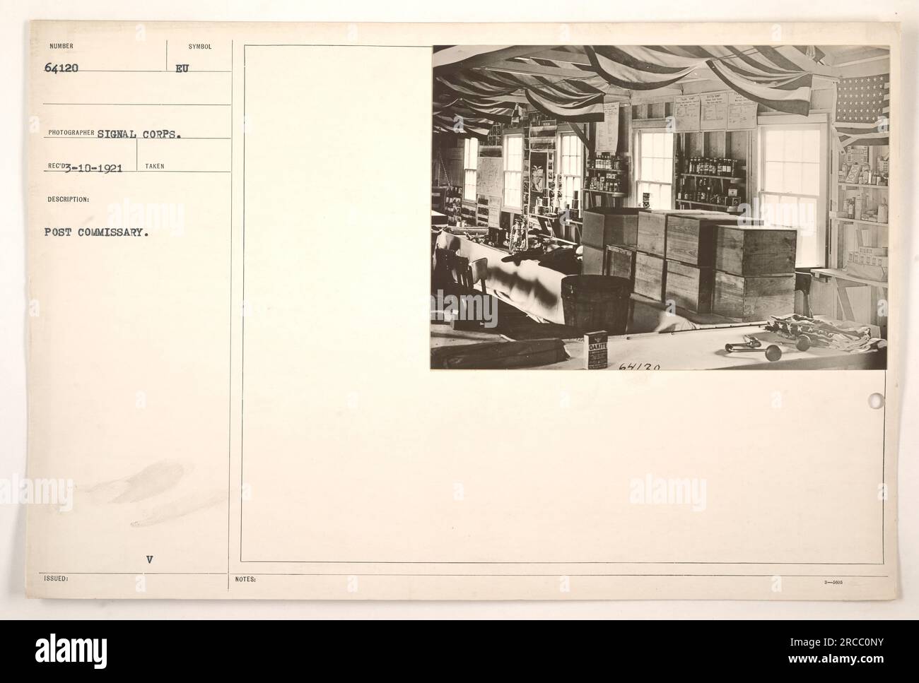 Soldiers lined up outside of the post commissary. The photograph ...