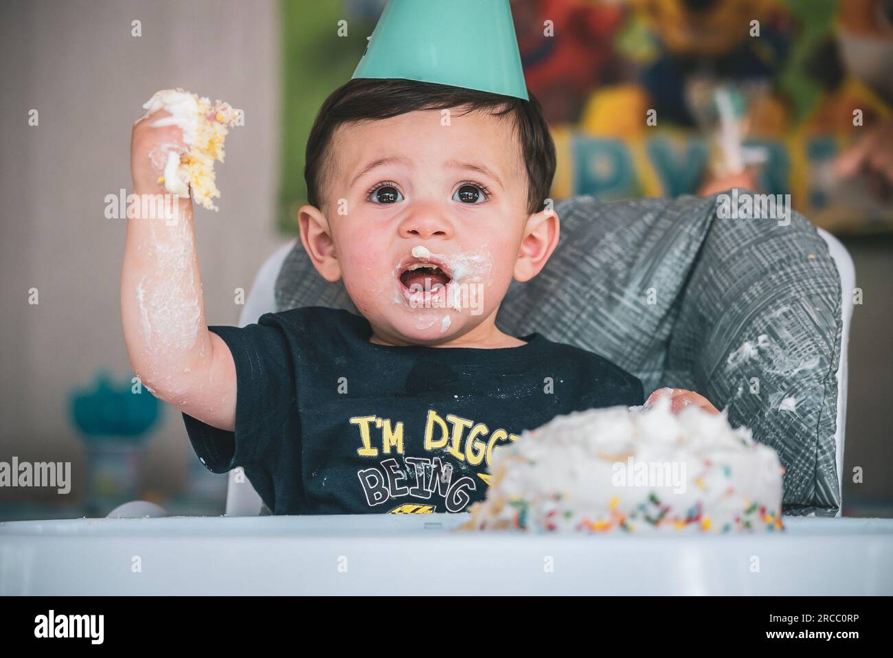 One year old boy eating cake with hands at birthday party Stock Photo ...