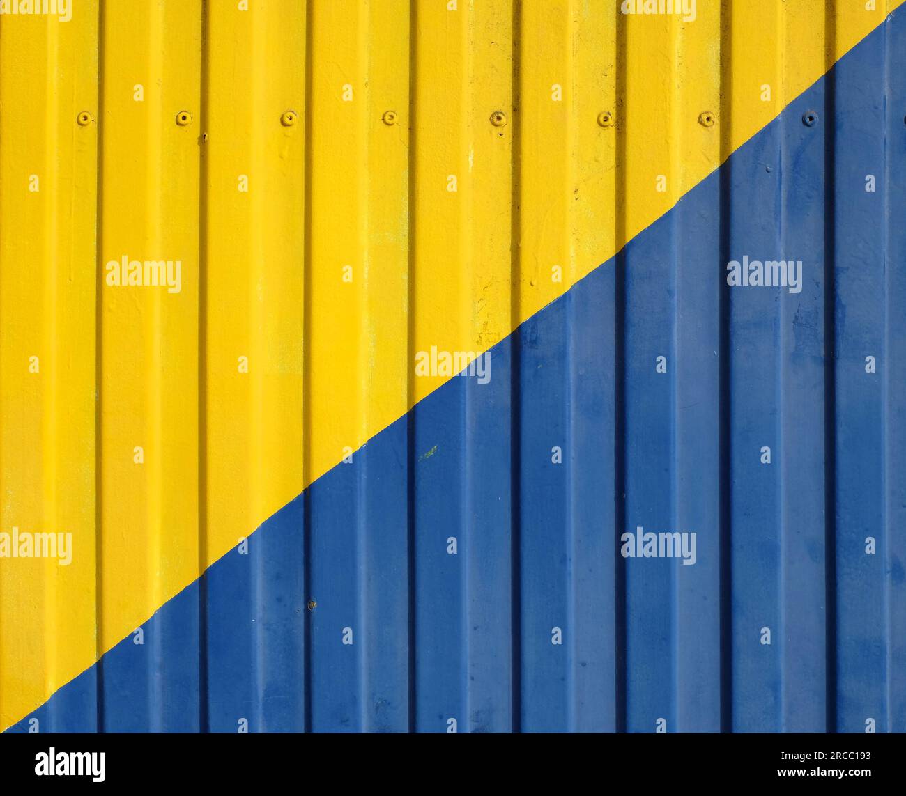 Yellow and blue painted surface, diagonal line, empty colorful ...