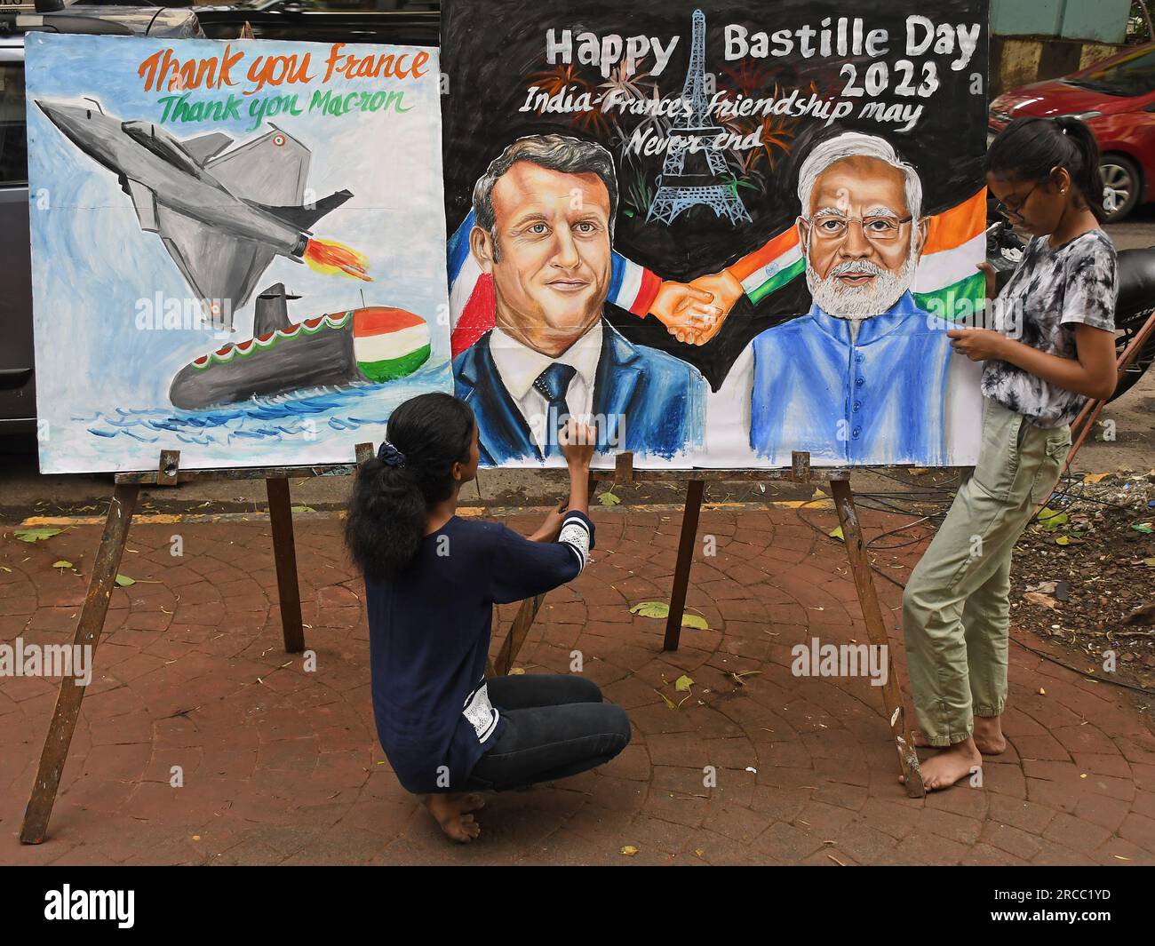 Mumbai, India. 13th July, 2023. Students paint poster thanking France ...