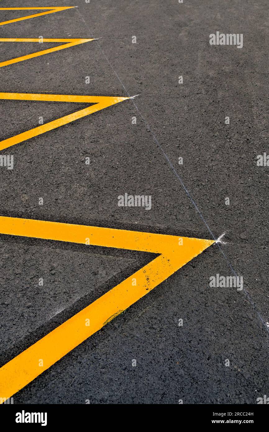 Parking lot marked in yellow reflective paint, an abstract detail Stock ...