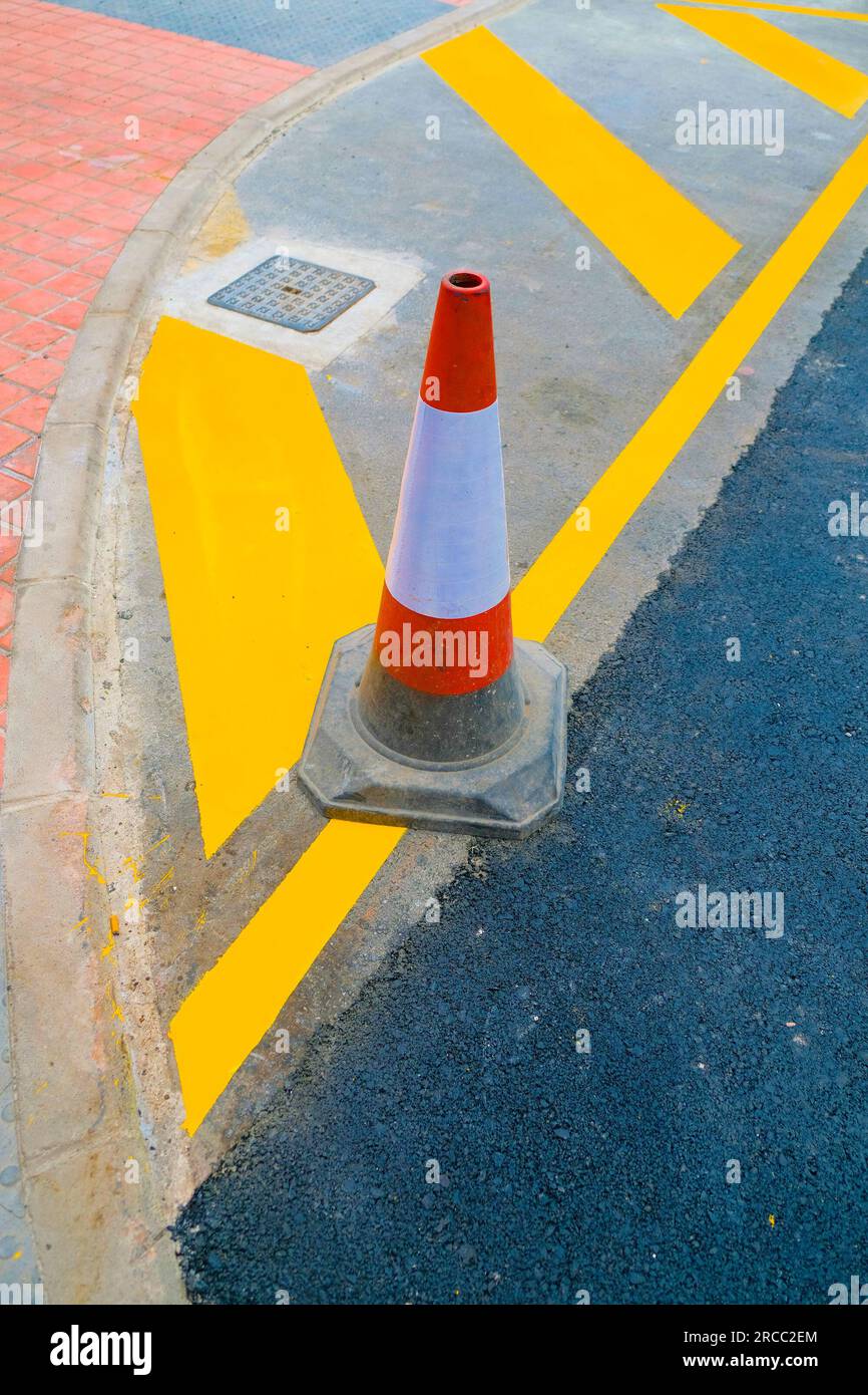 Road marking traffic cone and freshly painted parking lot signs Stock ...
