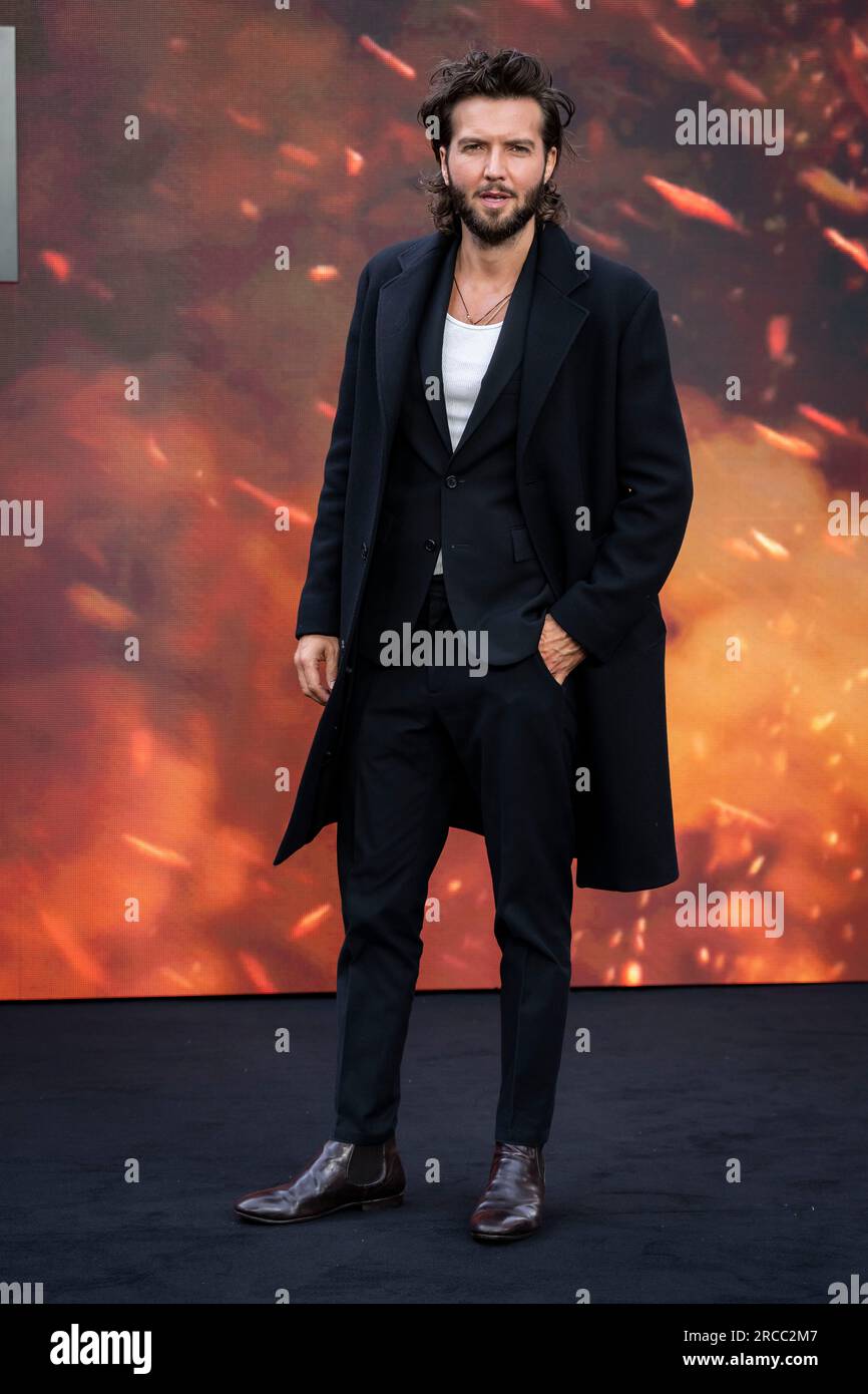 Guy Burnet poses for photographers upon arrival at the premiere of the ...