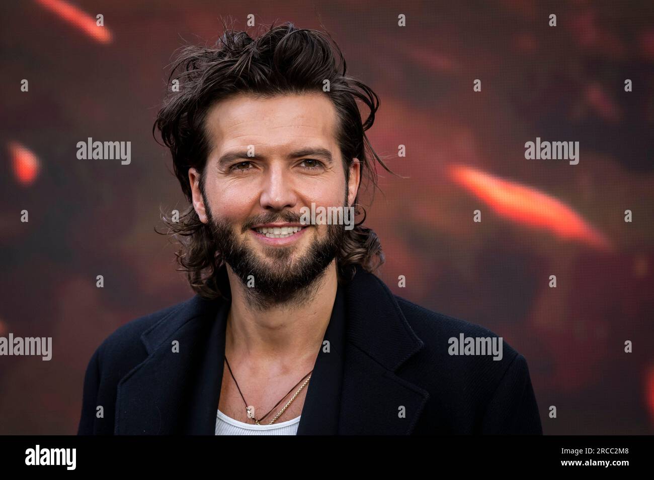 Guy Burnet poses for photographers upon arrival at the premiere of the ...