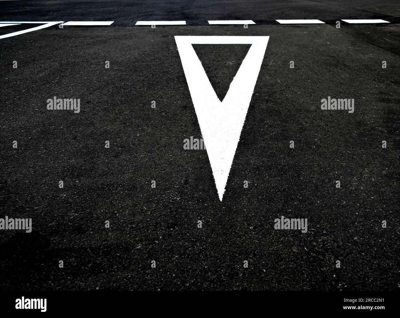 Abstract perspective view of white reflective paint road signage on ...