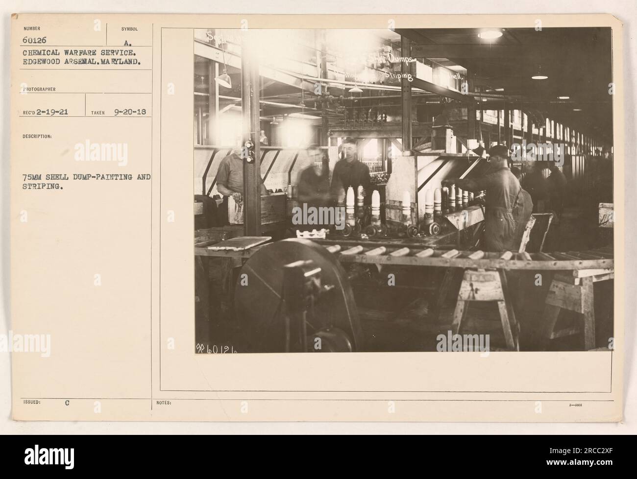 75MM shell dump at Edgewood Arsenal in Maryland. The shells are being ...