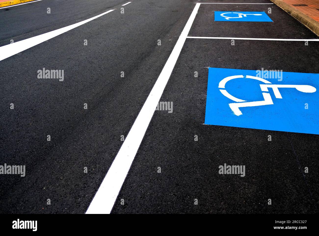 International Symbol of Access marking a reserved parking lot space ...