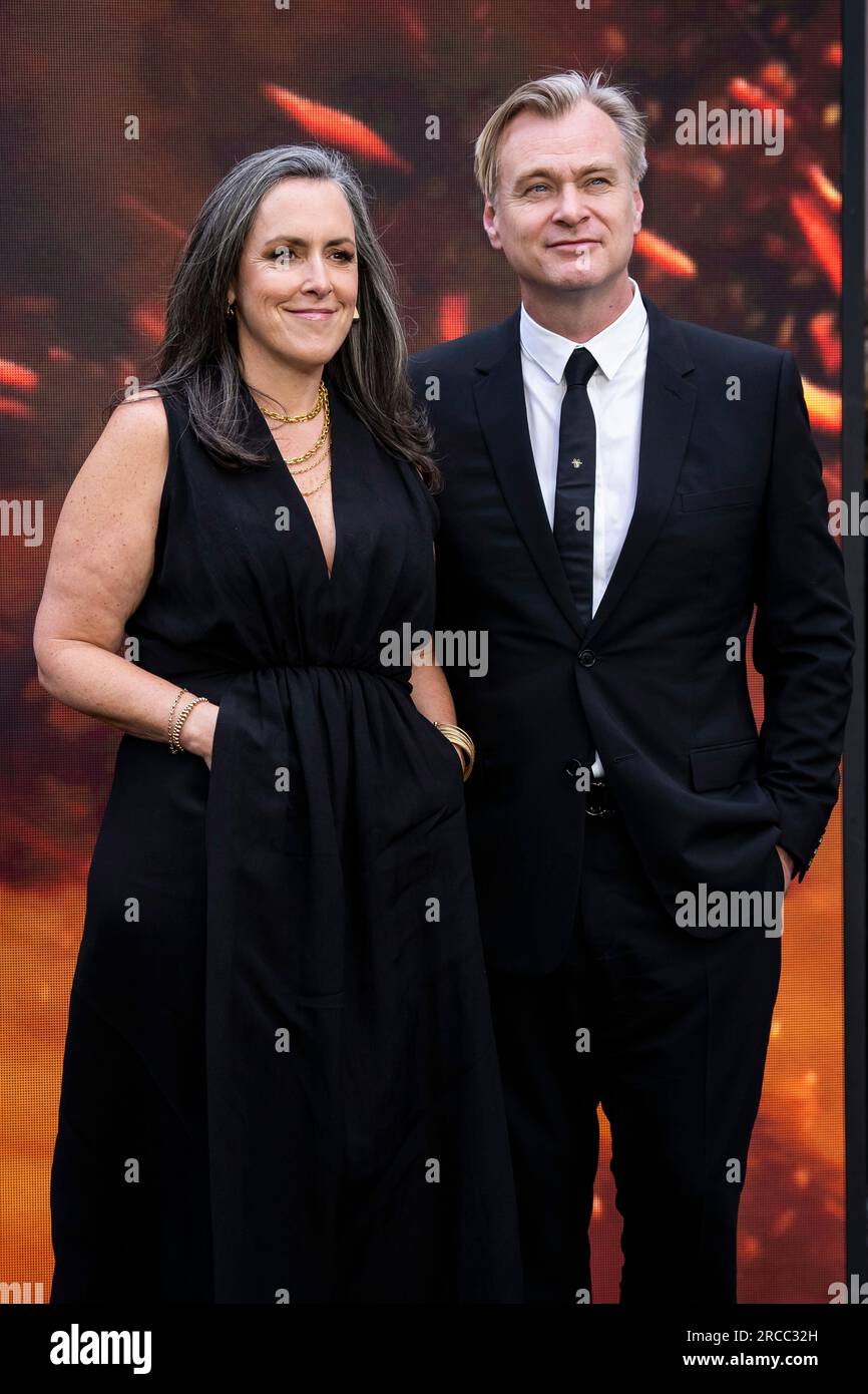 Emma Thomas, left, and Christopher Nolan pose for photographers upon ...