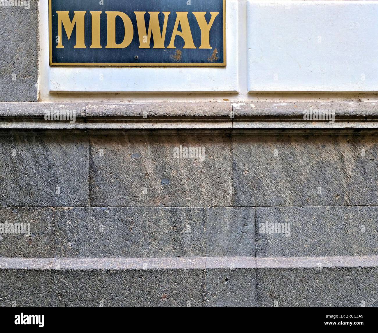 Word midway on an empty wall Stock Photo - Alamy