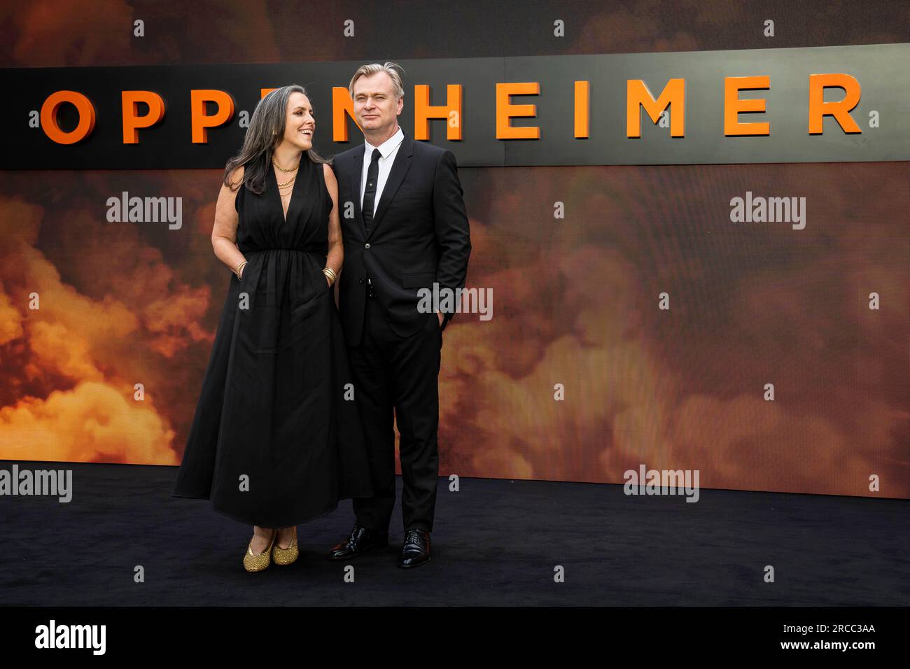 Emma Thomas, left, and Christopher Nolan pose for photographers upon ...