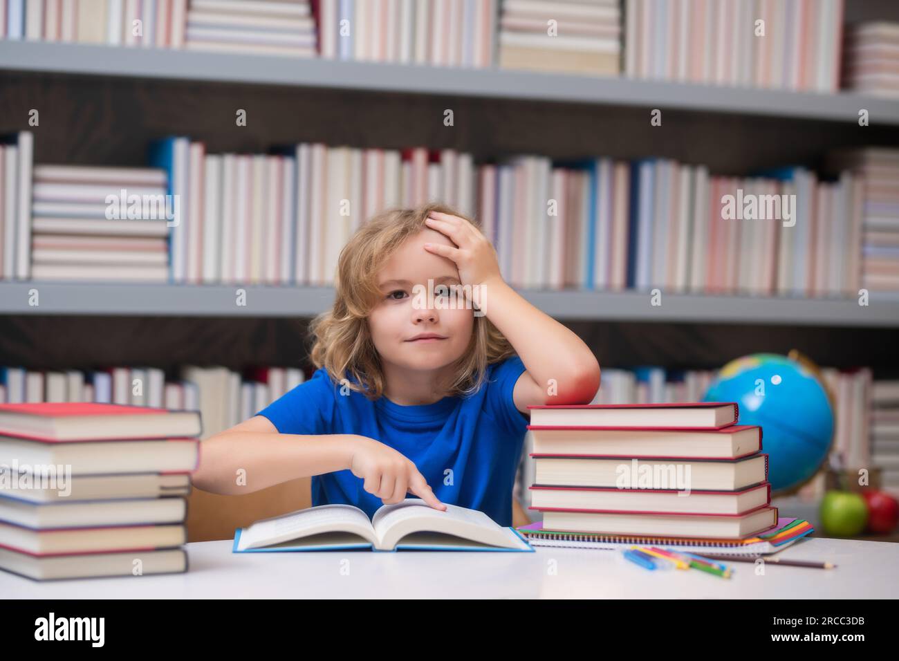 Knowledge and education school concept. School boy pupil reading book ...