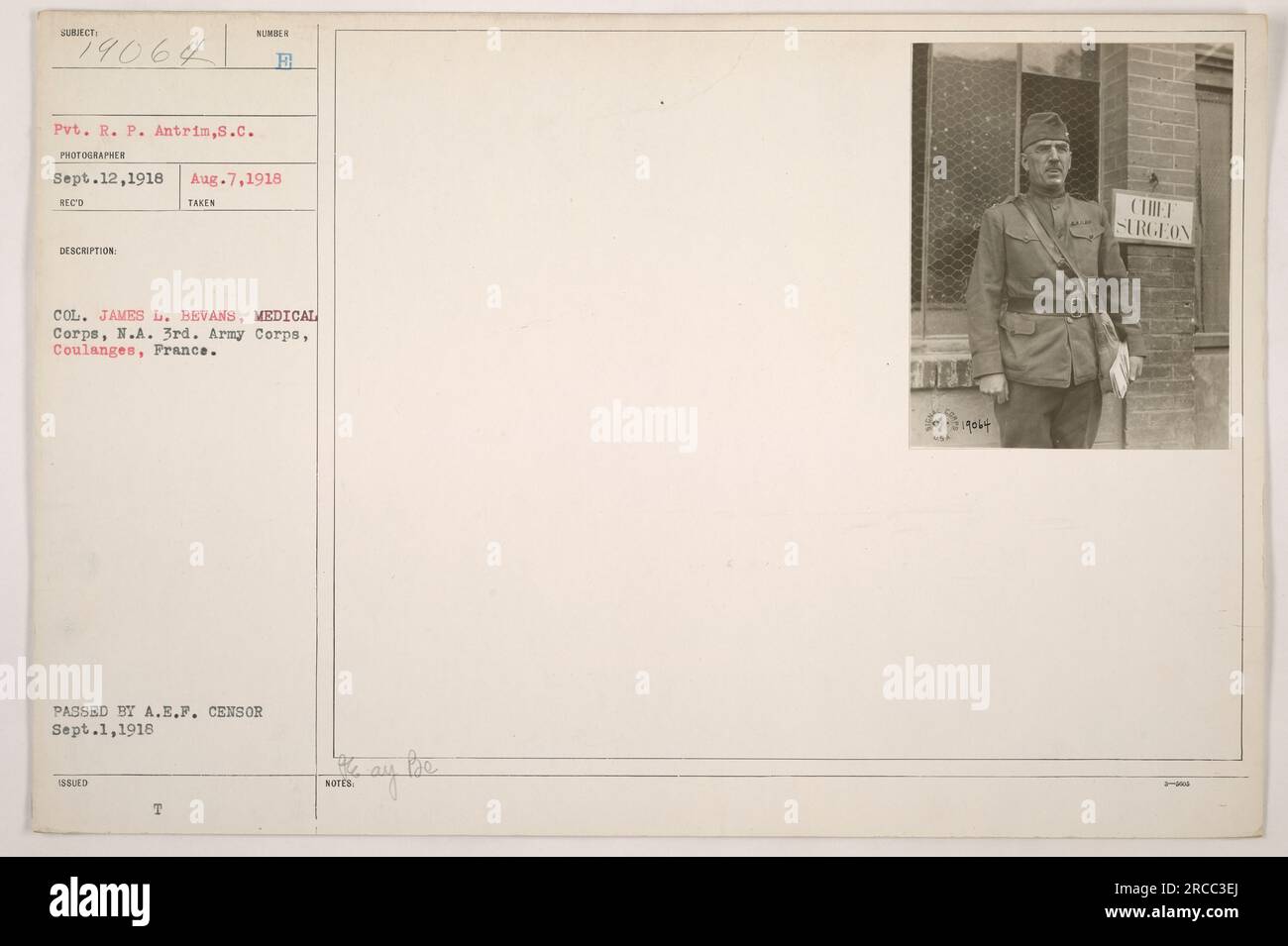 In this photograph, Pvt. R. P. Antrim of the S.C. is seen receiving ...