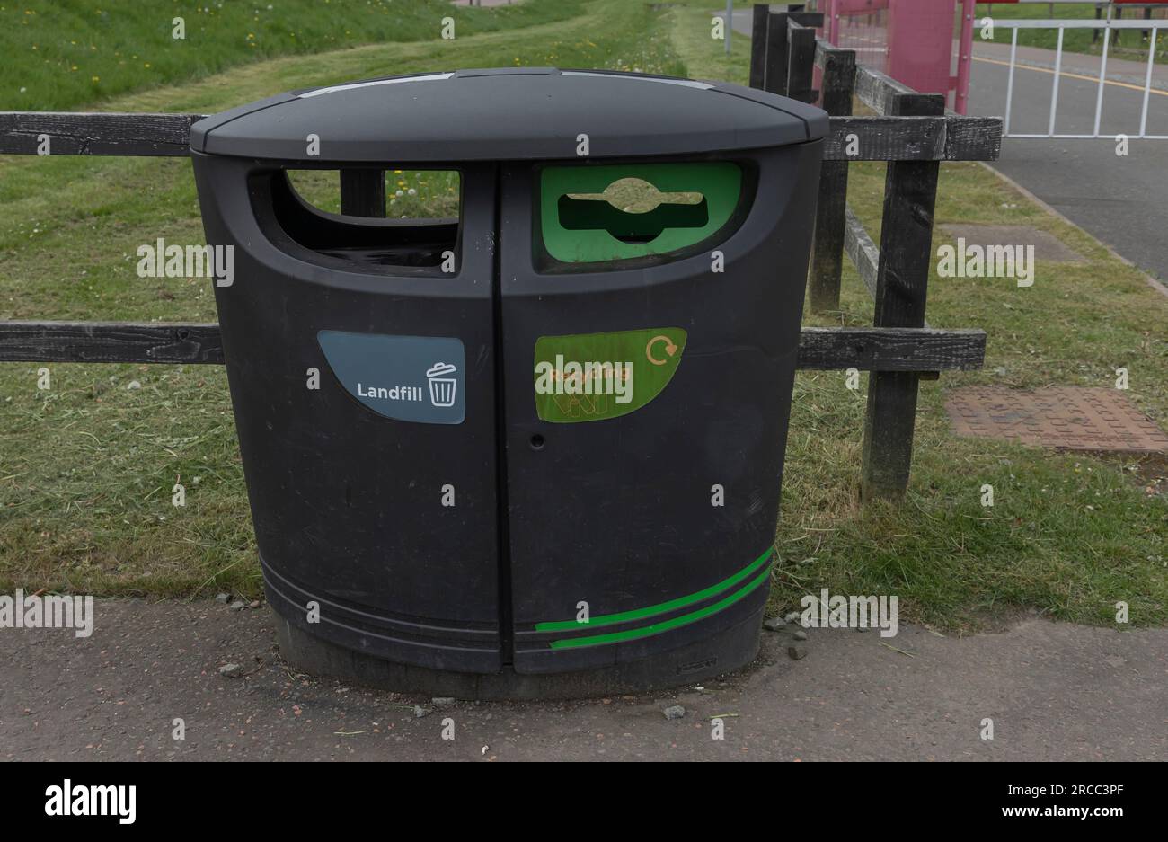 Street litter bin with segregated parts for recycling and landfill ...