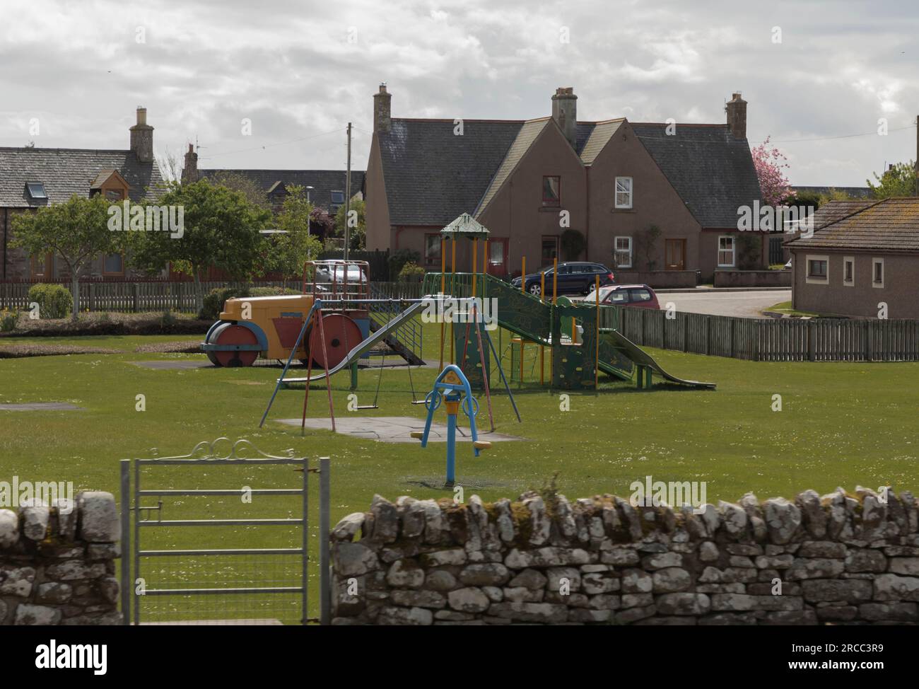 Scotland, UK - May 9th 2023 - Looking at a childrens playground over a ...