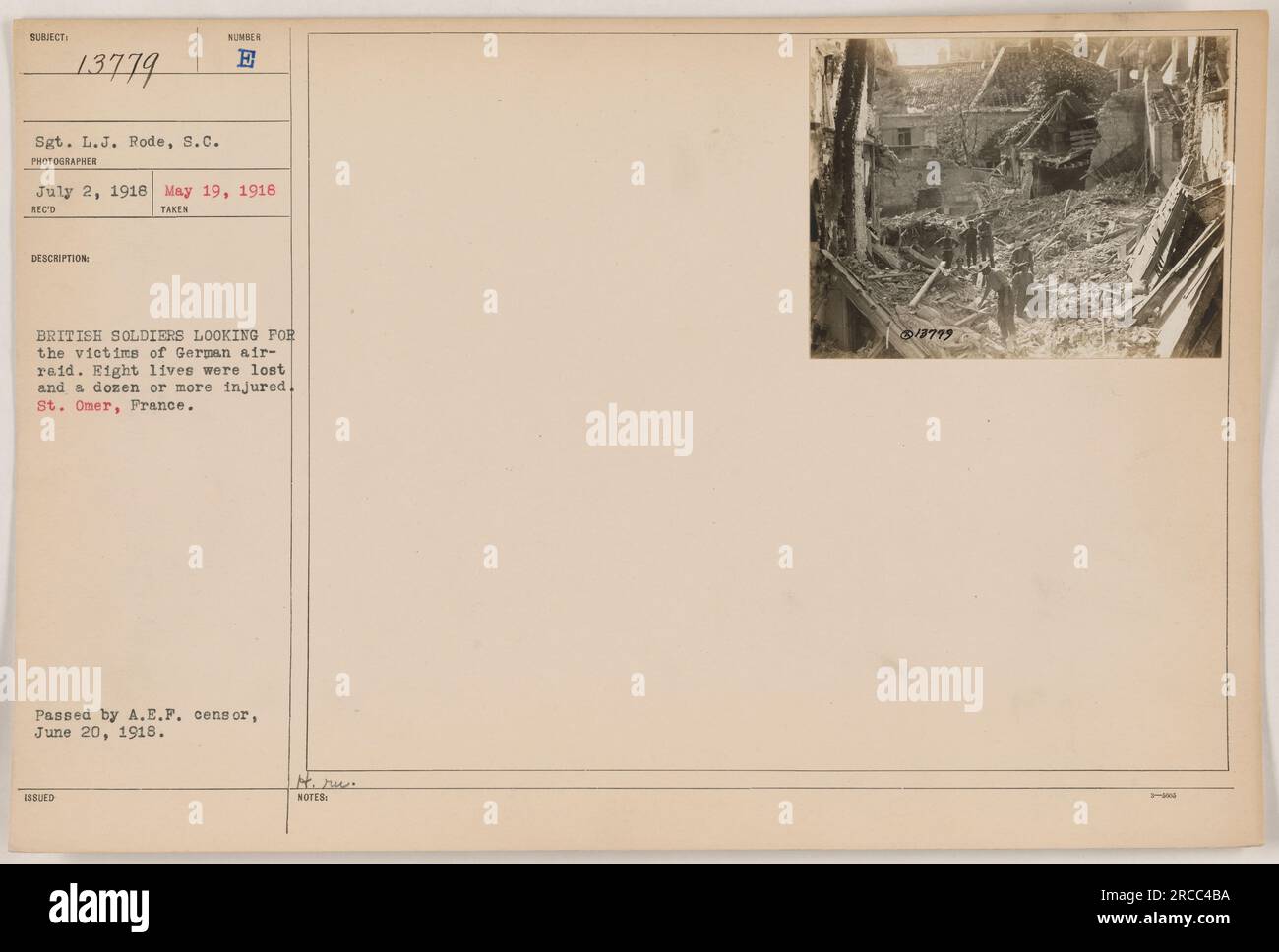 British soldiers searching for the victims of a German air raid in St ...