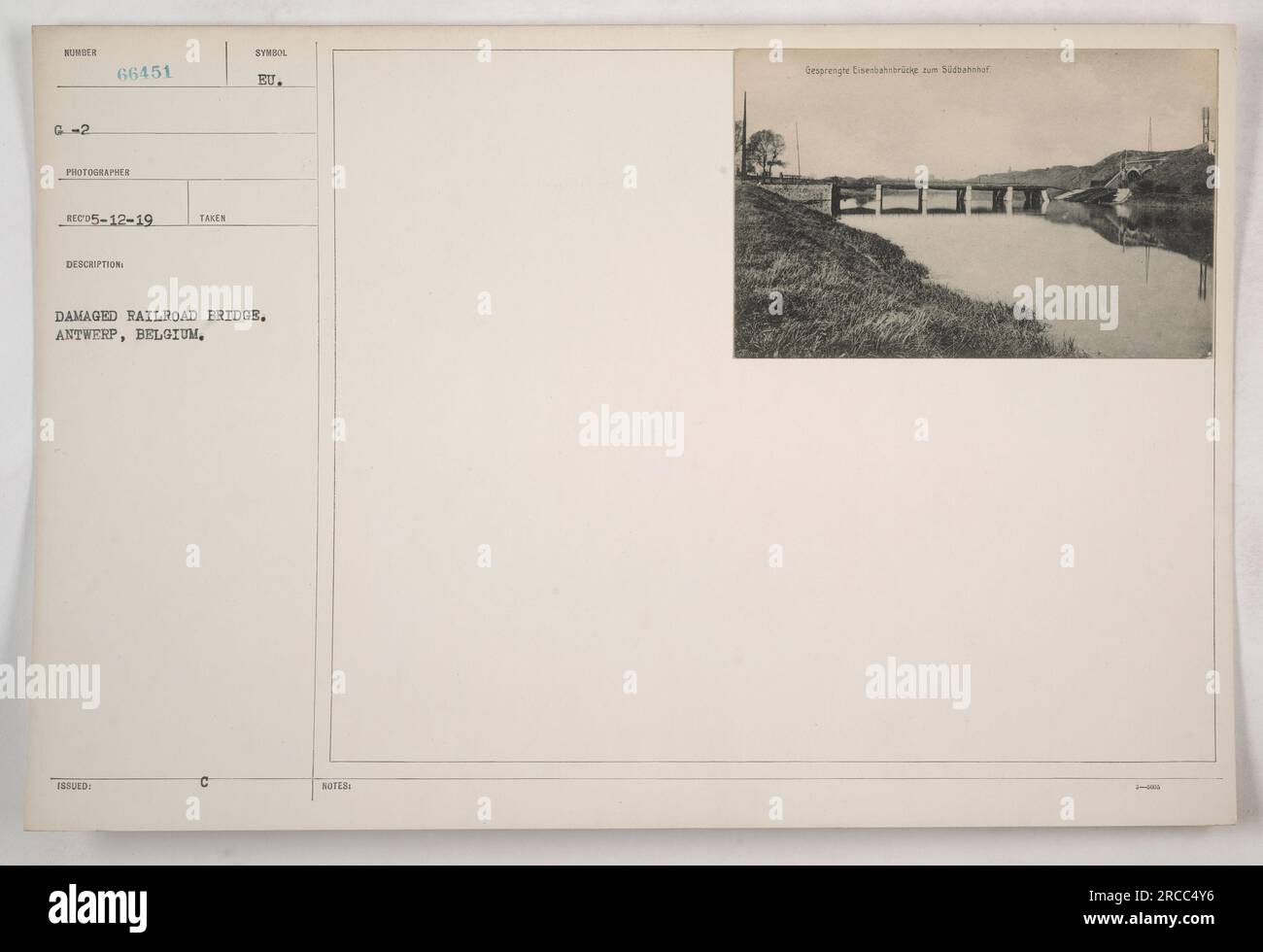 This photograph shows a damaged railroad bridge in Antwerp, Belgium ...