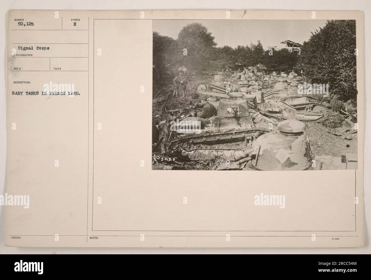 "A group of baby tanks lined up in a French yard. This photo, number 50 ...