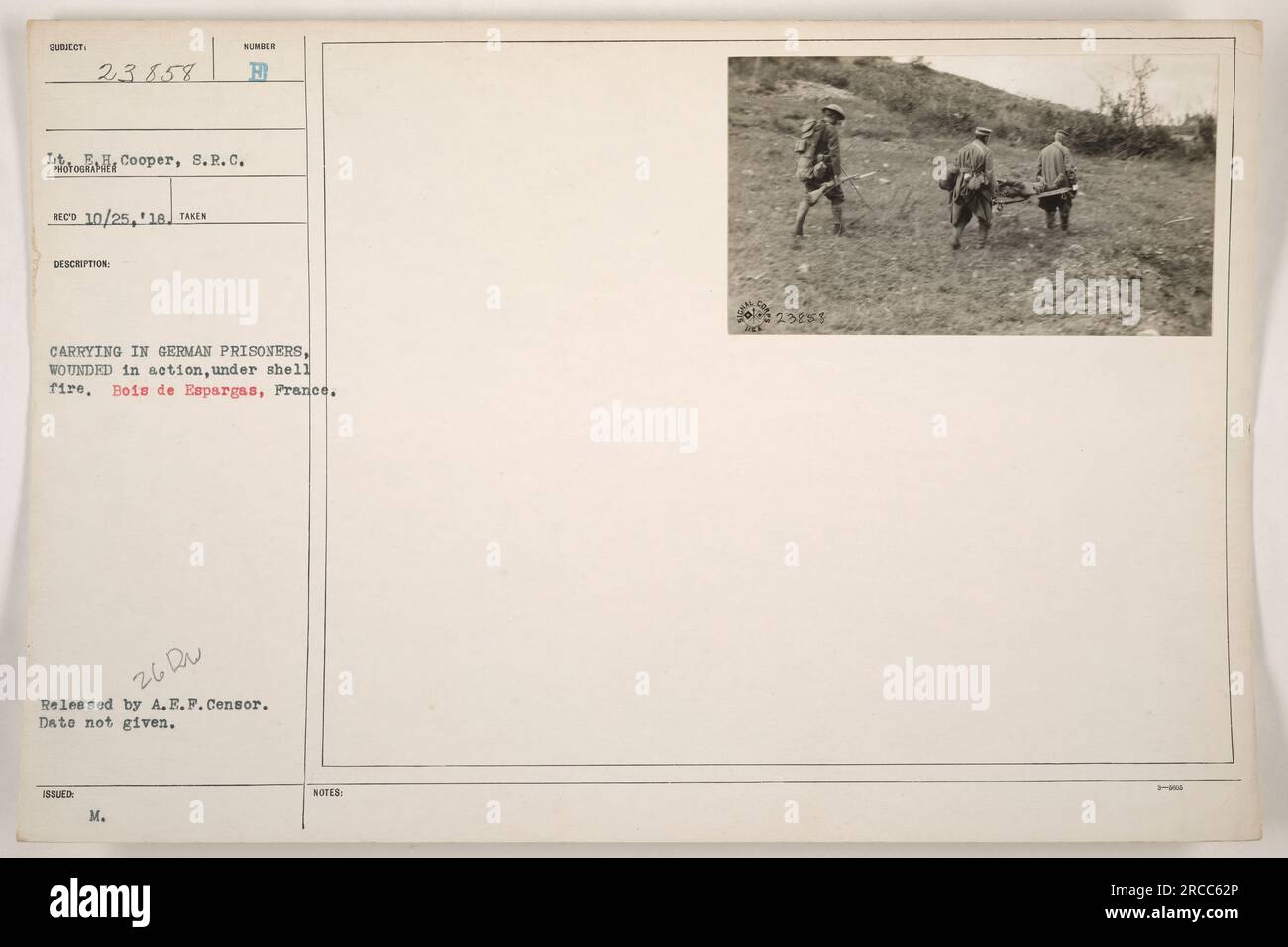 Soldiers under shell fire carry wounded German prisoners in the Bois de ...