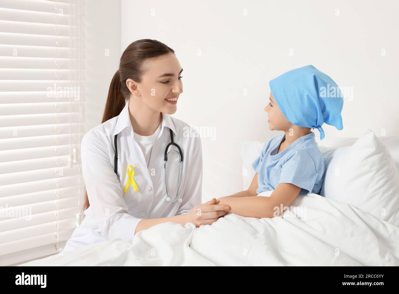 Childhood cancer. Doctor and little patient in hospital Stock Photo - Alamy