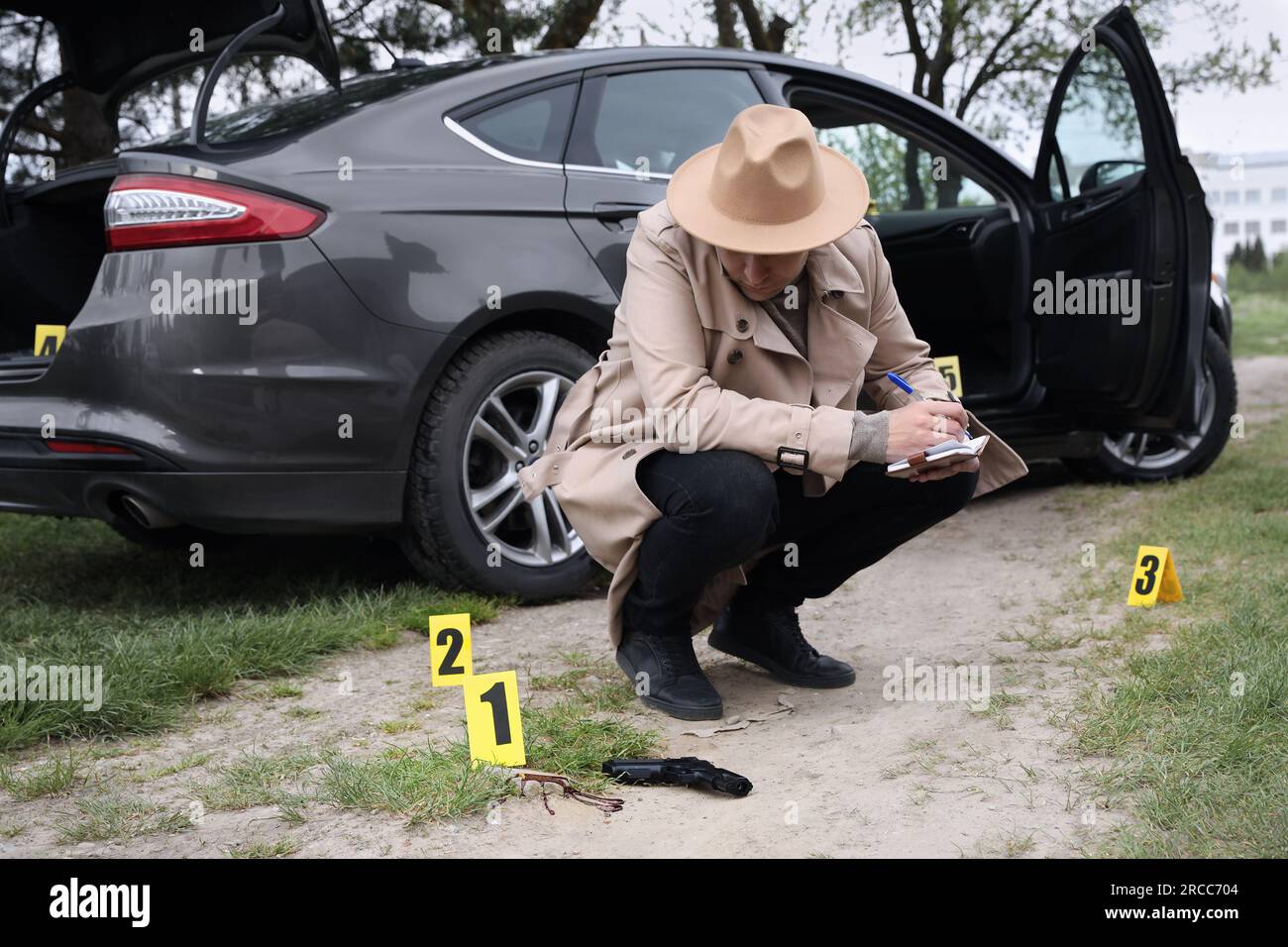 Police evidence examination detective examining hi-res stock ...