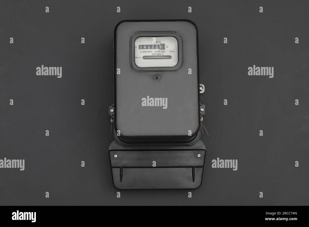 Electric meter on black background, top view. Measuring device Stock ...