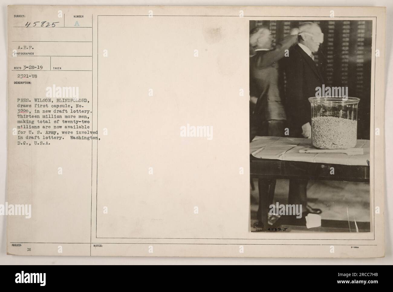 Pres. Wilson draws the first capsule in the new draft lottery. With 13 ...