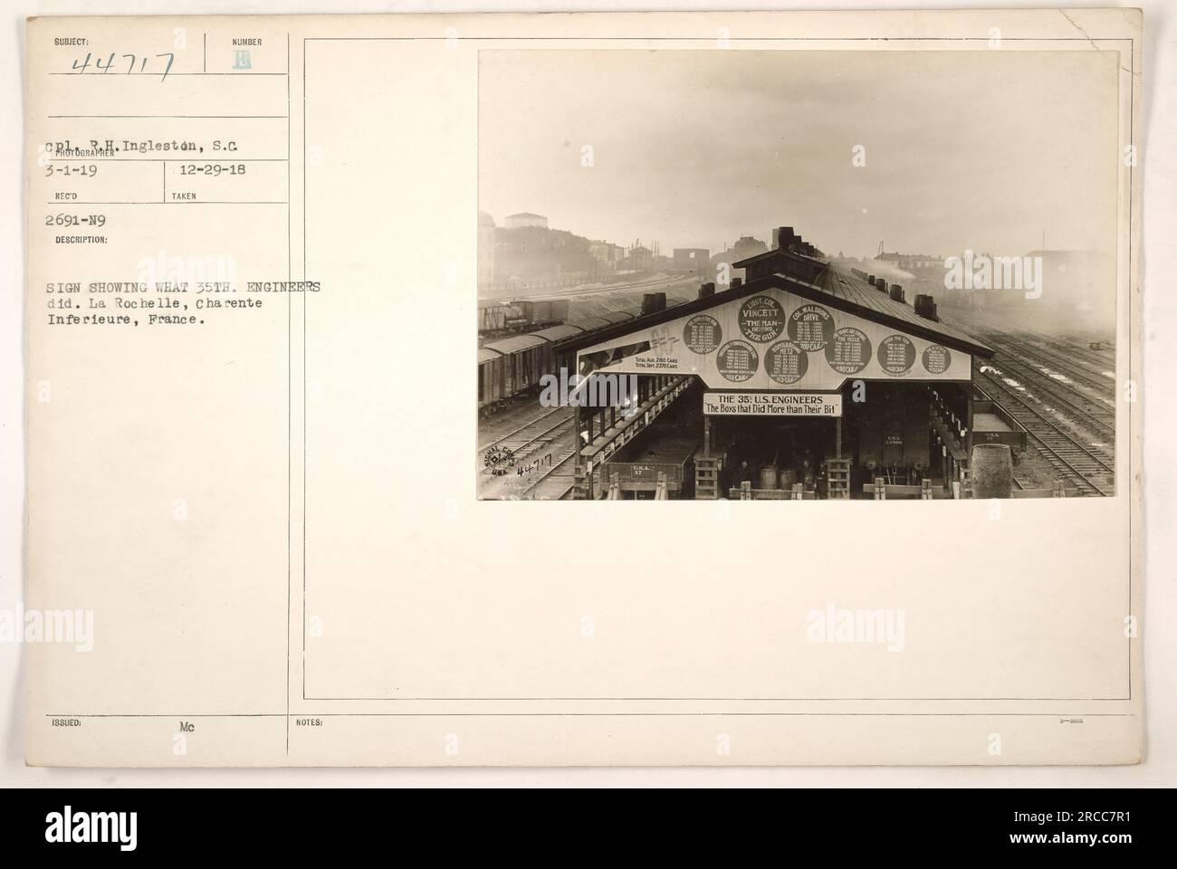 Caption: A group of soldiers from the 35th Engineers standing in front ...