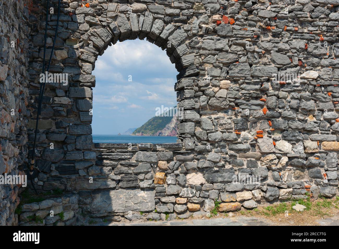 Stone arched window frames view over Ligurian sea from Portovenere ...