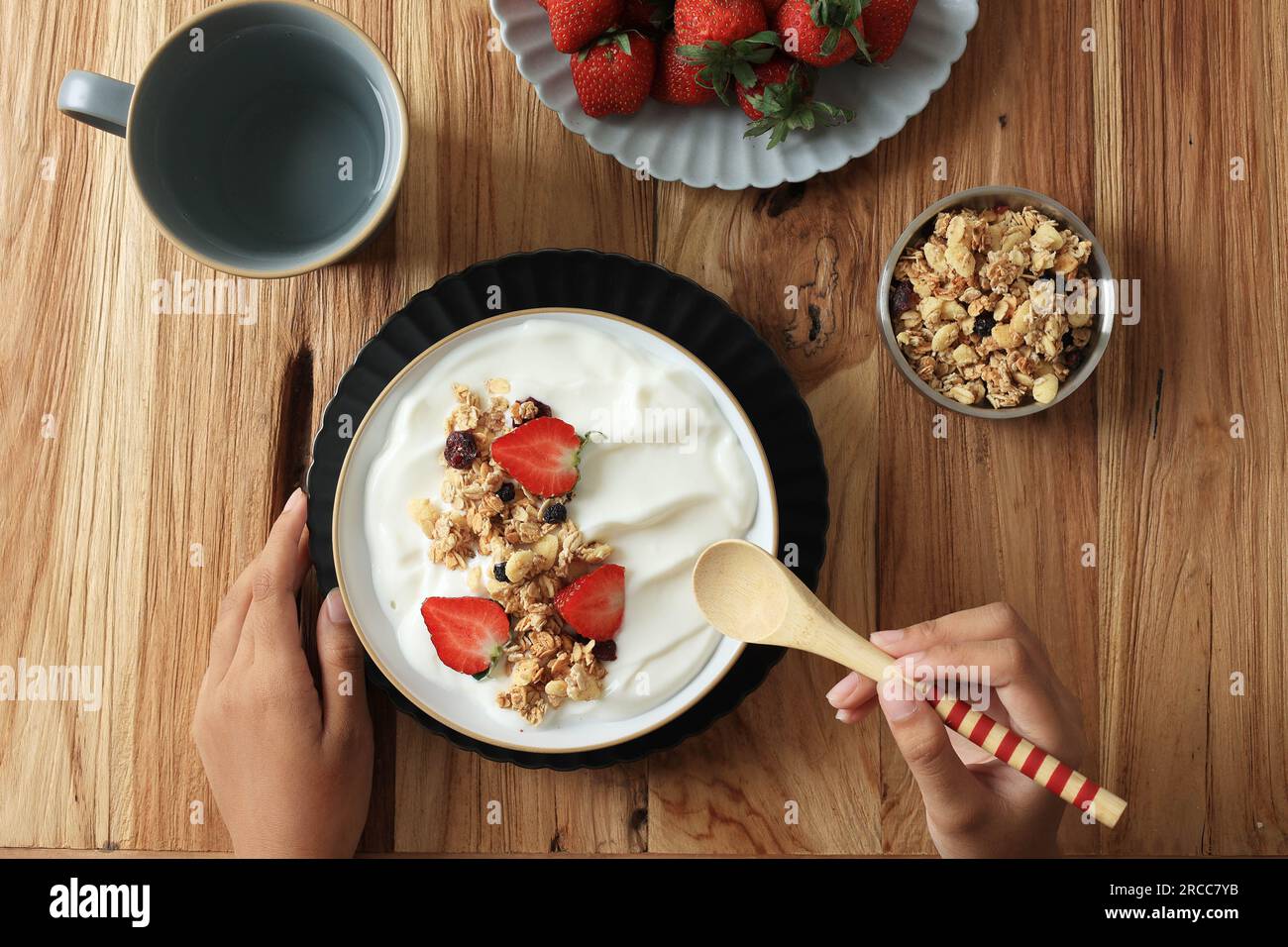Top View Female Hand Eating Greek Yoghurt and Granola for Breakfast ...