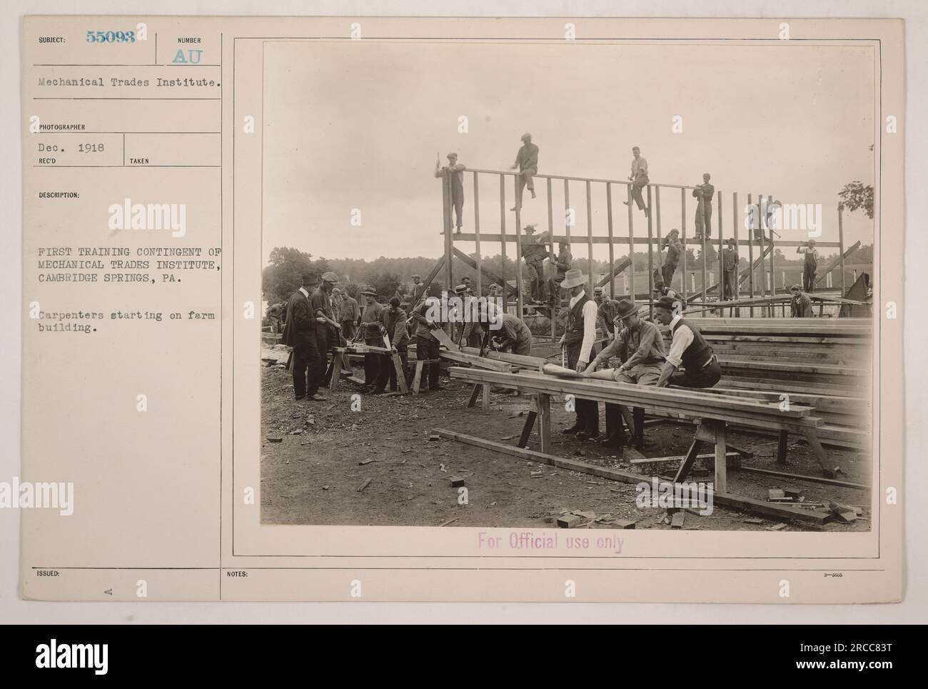 The image shows a group of carpenters from the first training ...