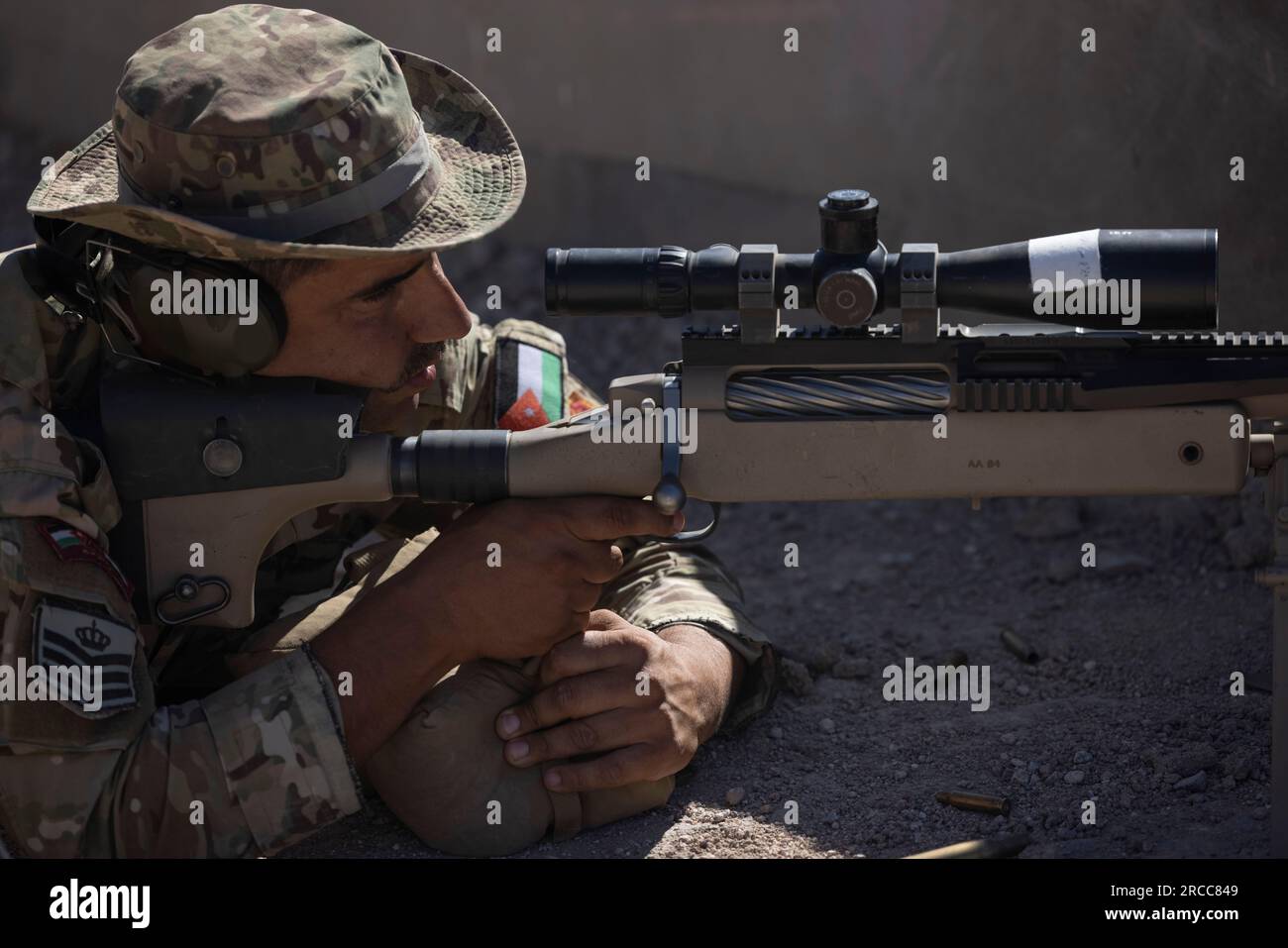 A member of the Jordanian Armed Forces conducts sniper training during ...