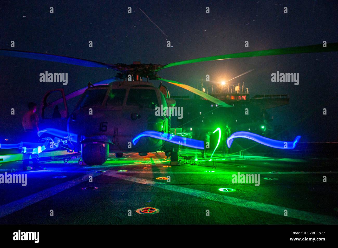 230711-N-NH267-1237 GULF OF OMAN (July 11, 2023) Sailors inspect an MH ...