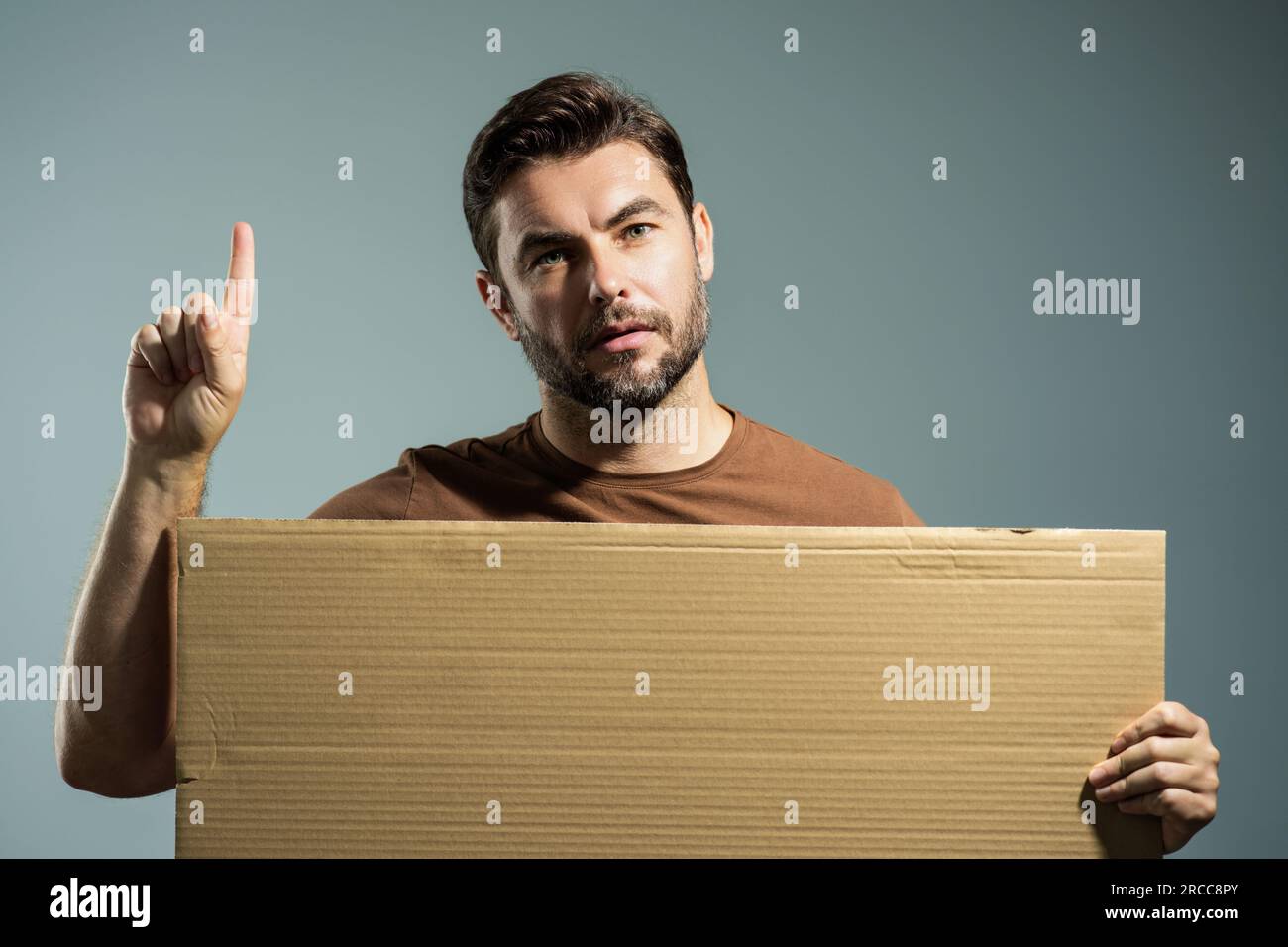 Man holds the sign, idea blank card. Placard ready for your idea ...