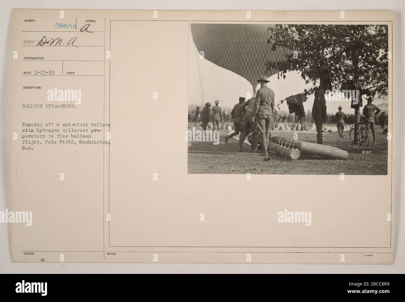 Soldiers preparing a spherical balloon for flight at the Polo Field in ...