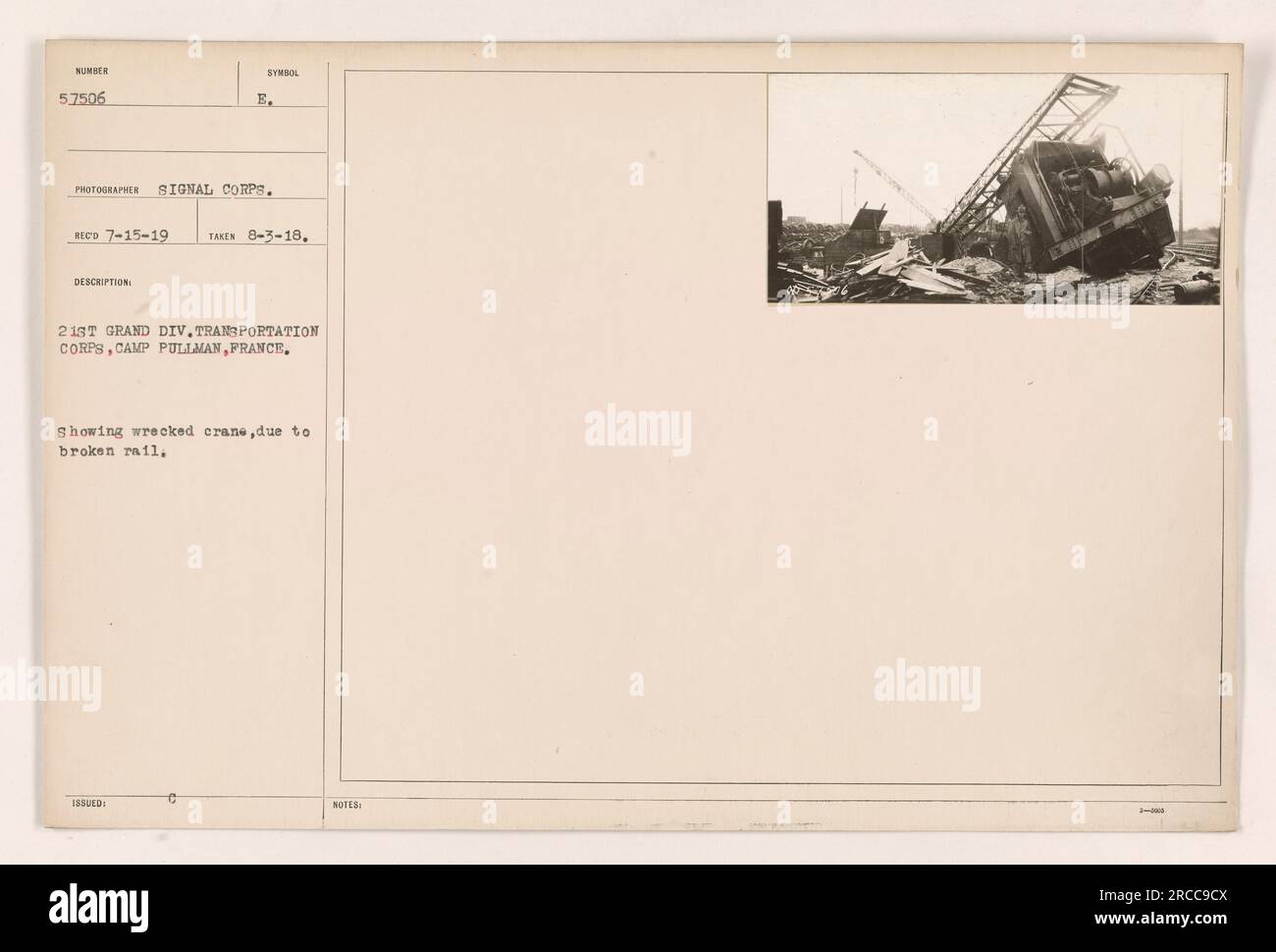 This photograph depicts a wrecked crane at Camp Pullman in France ...
